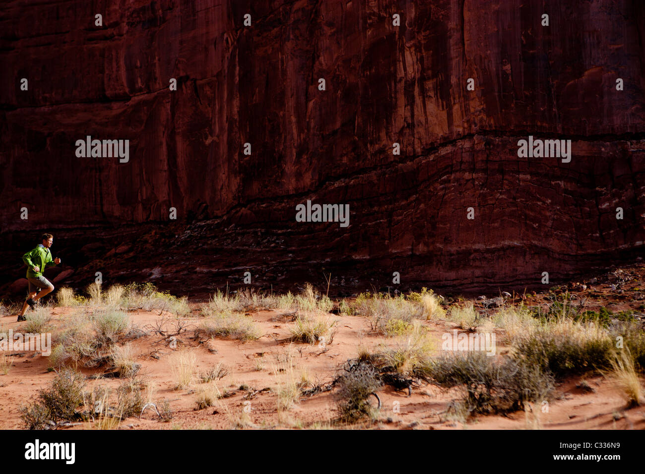 Male runner (28 years) running in Arches National Park Stock Photo - Alamy