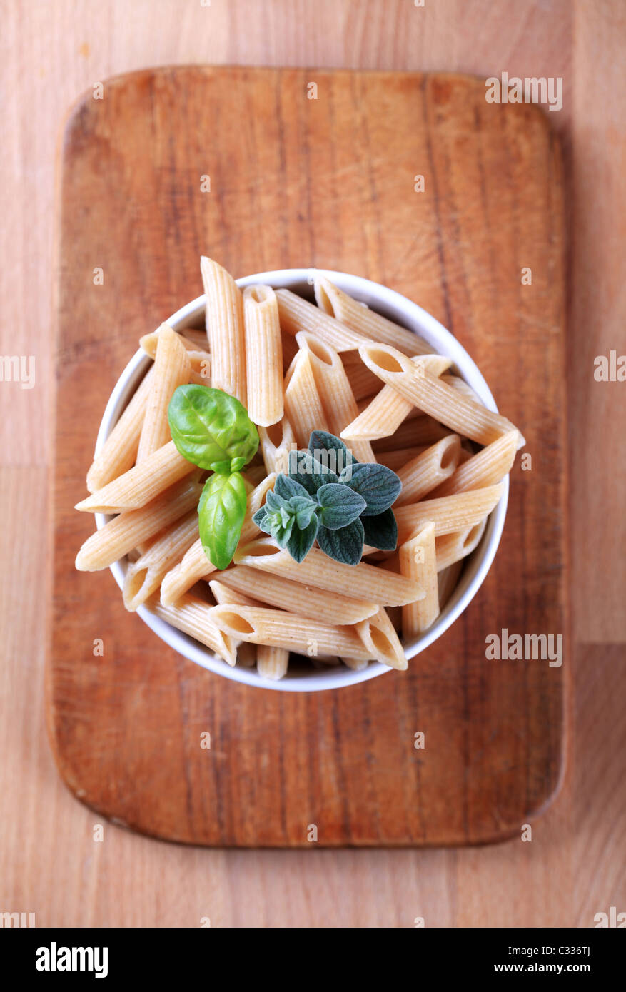 Bowl of whole wheat pasta tubes - overhead Stock Photo - Alamy