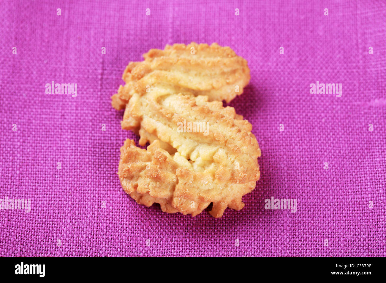 S-shaped cookie on a purple napkin - detail Stock Photo - Alamy