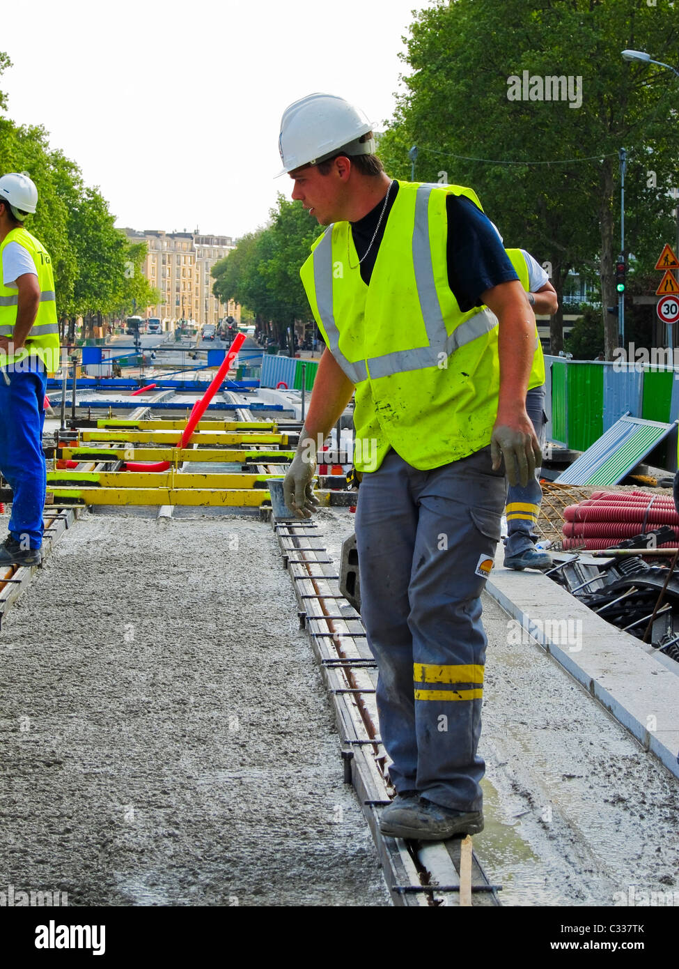 Paris, France, Tramway T3 Workers at Construction Site, Men Pouring ...