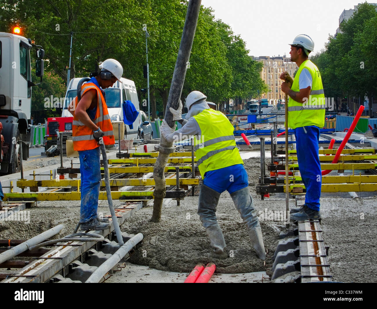 Paris, France, Tramway T3 Workers at Construction Site, Men Laying ...