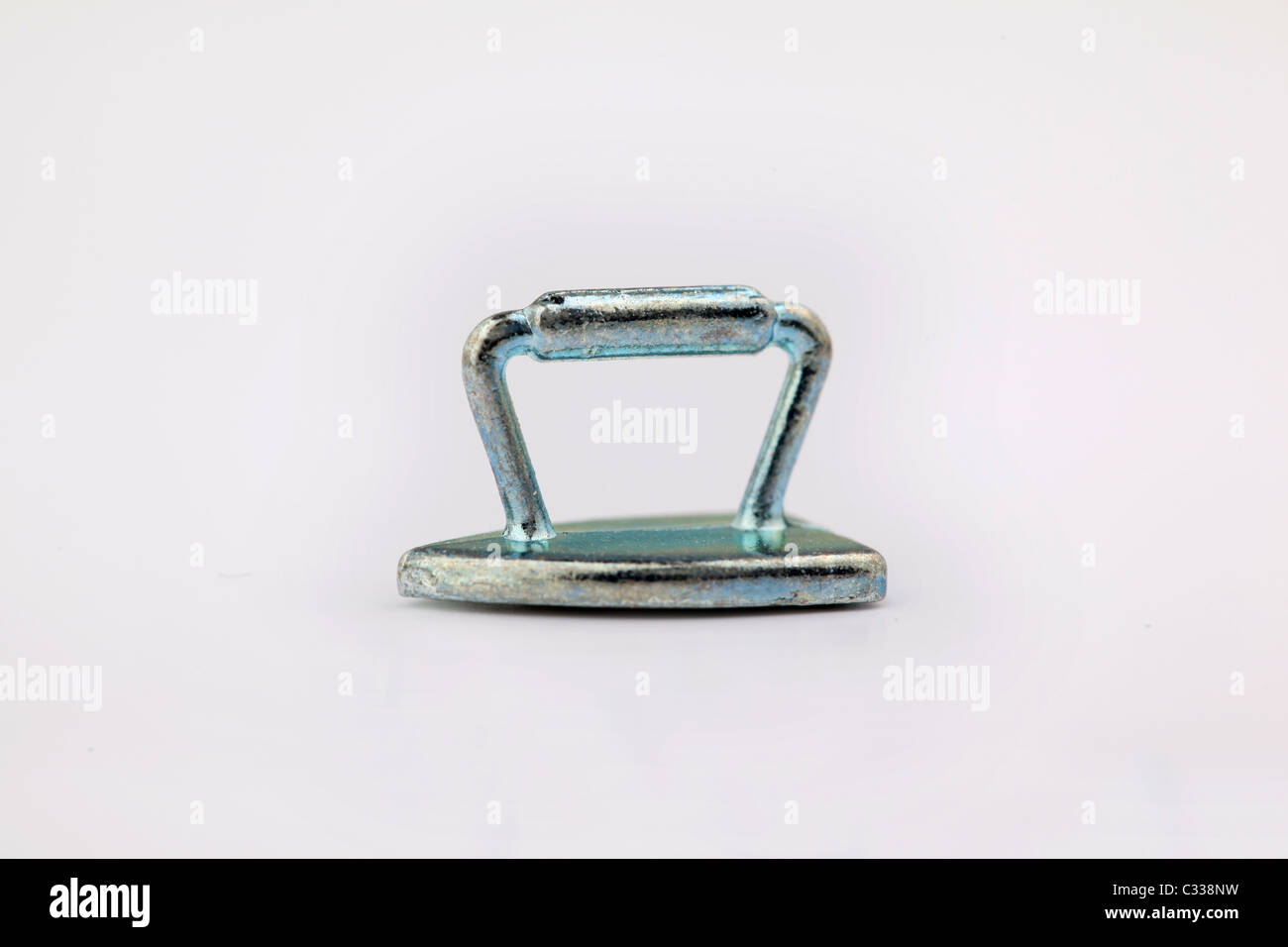 The iron piece from Monopoly Stock Photo - Alamy