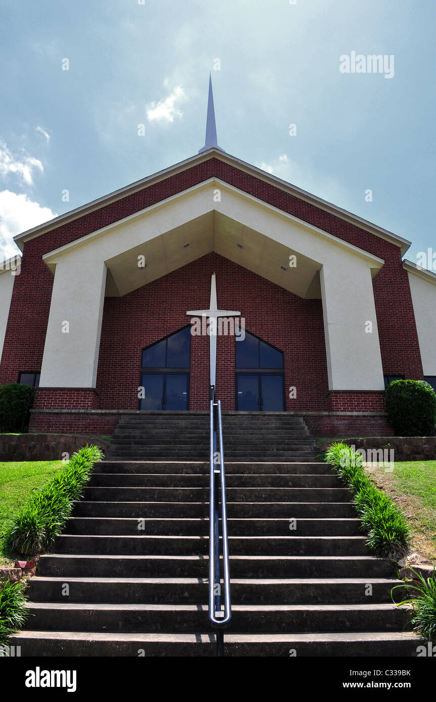 A beautiful church on a hill with a long stairway leading up to the ...