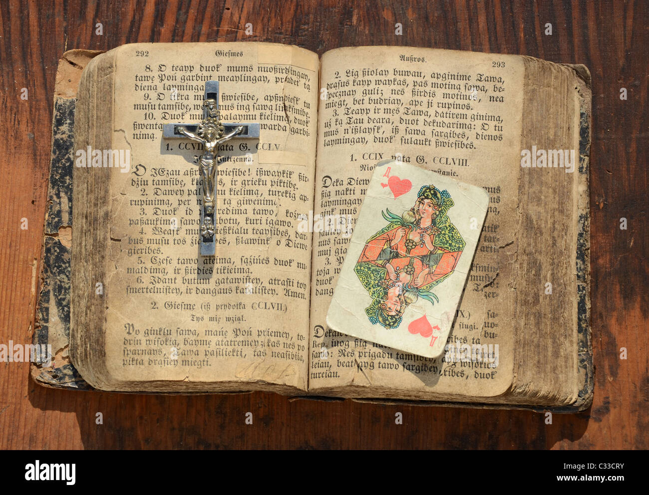 old book with crucifixion and queen of hearts Stock Photo - Alamy