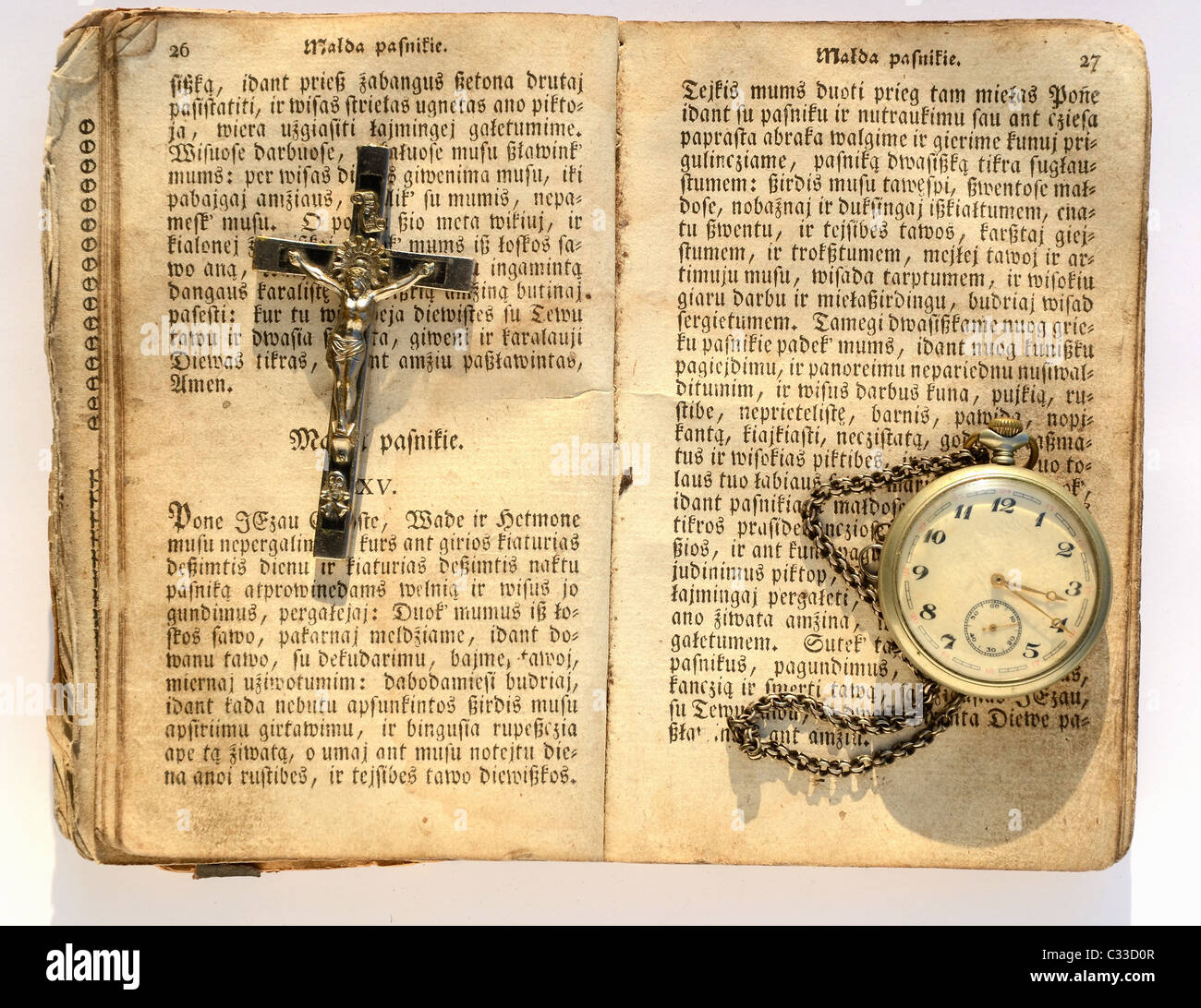 old religious book with clock and crucifixion Stock Photo - Alamy
