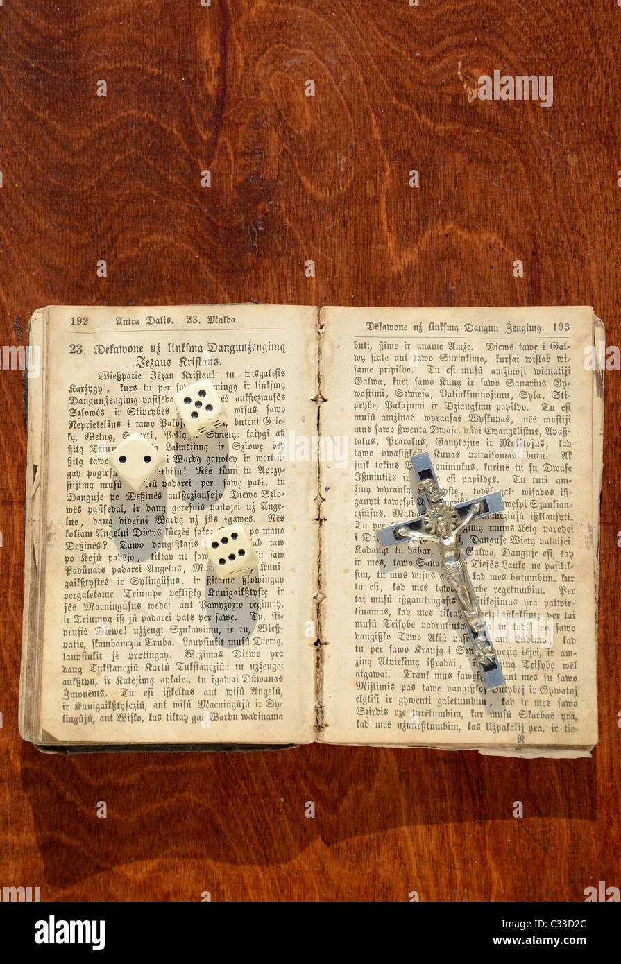 old religious book with crucifixion and dice Stock Photo - Alamy