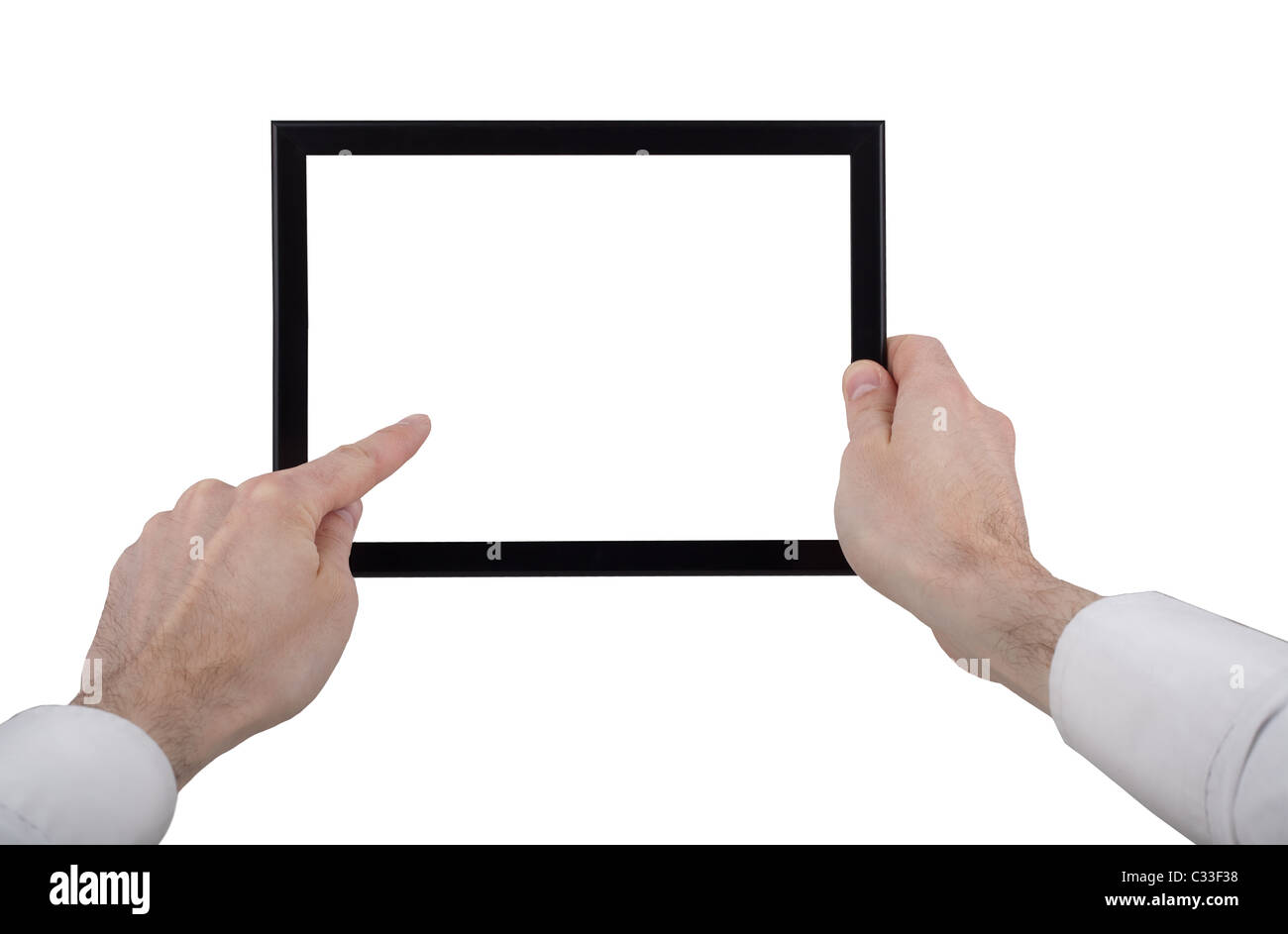 a male hand holding a touchpad pc, one finger touches the touchpad ...