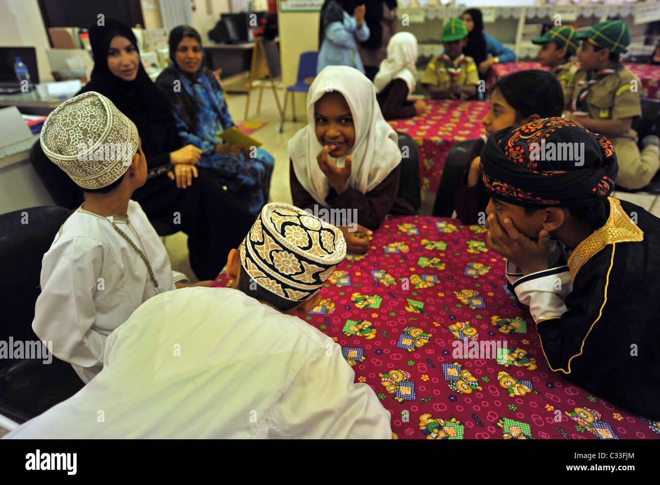 Children sitting around table school hi-res stock photography and ...
