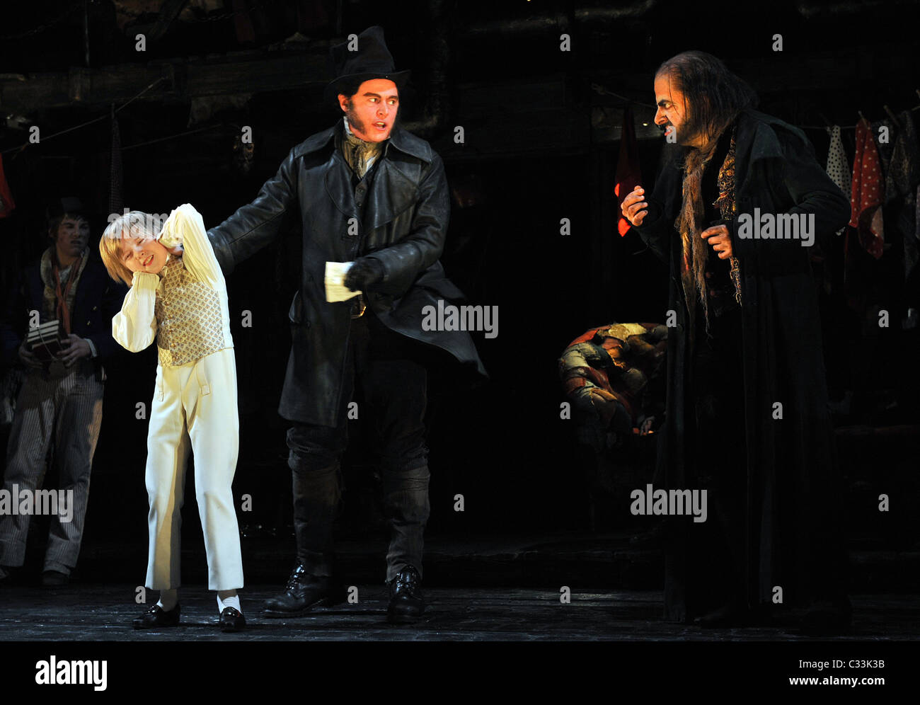 Gwion Wyn Jones as Oliver and Rowan Atkinson as Fagin Oliver ...