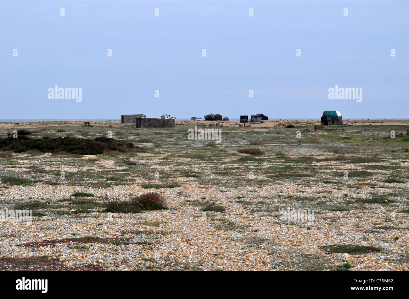 Dungeness shingle beach with huts Stock Photo - Alamy
