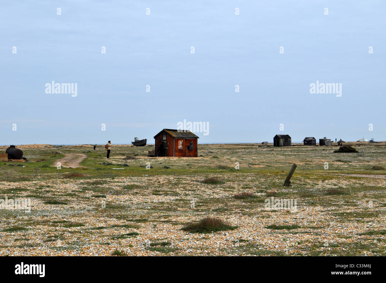 Dungeness shingle beach with huts Stock Photo - Alamy
