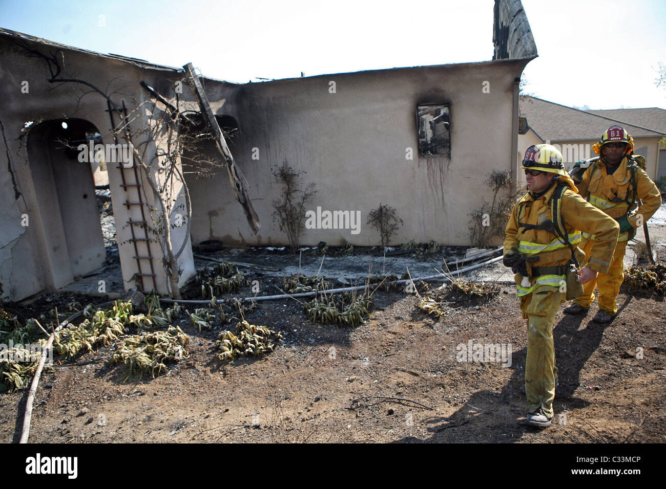 Firefighters Jamie Castaneda and Brian Wilson from LAFD Sta. 61 help ...