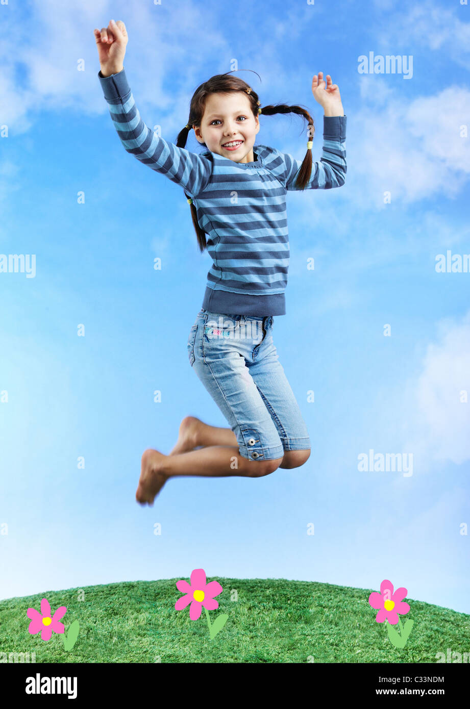 Image of happy girl jumping on the grass Stock Photo - Alamy