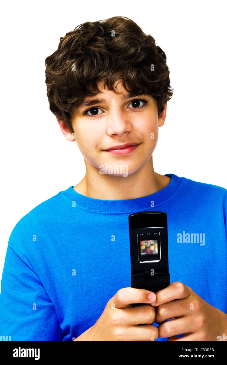 Portrait of a boy text messaging on a mobile phone isolated over white ...