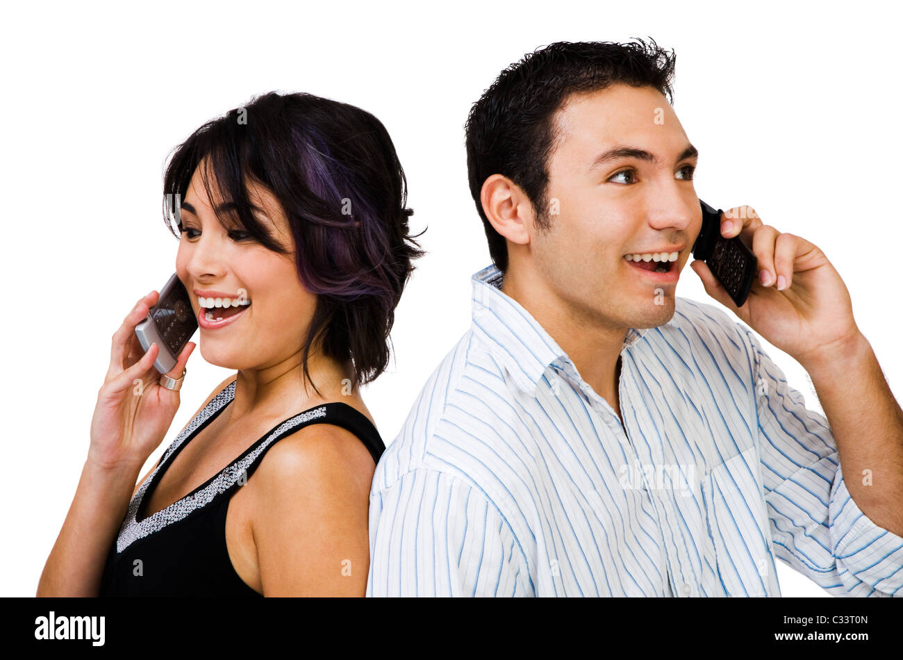 Smiling couple talking on mobile phones isolated over white Stock Photo ...
