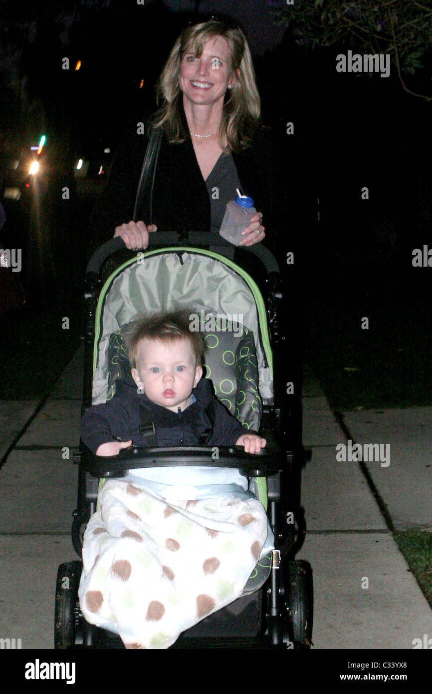 Courtney Thorne-Smith goes for a stroll with her son Jacob Fishman ...