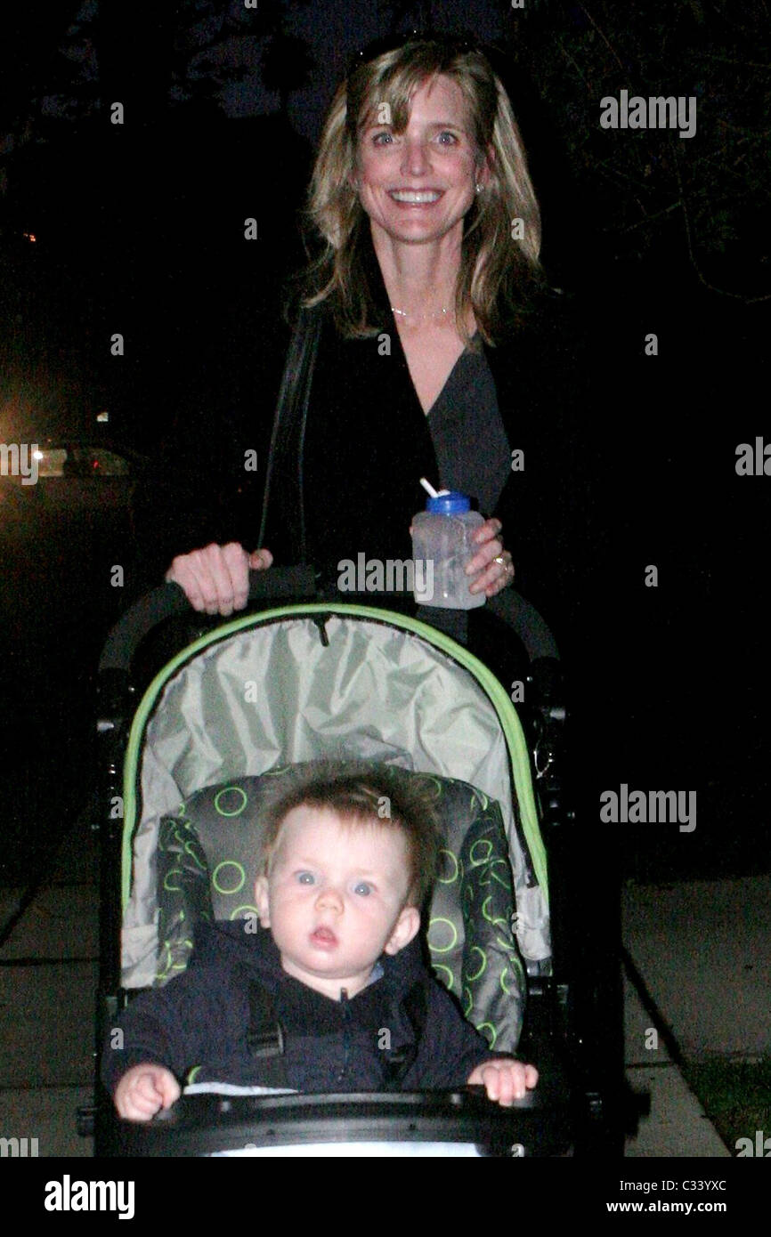 Courtney Thorne-Smith goes for a stroll with her son Jacob Fishman ...