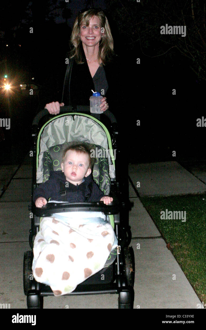 Courtney Thorne-Smith goes for a stroll with her son Jacob Fishman ...