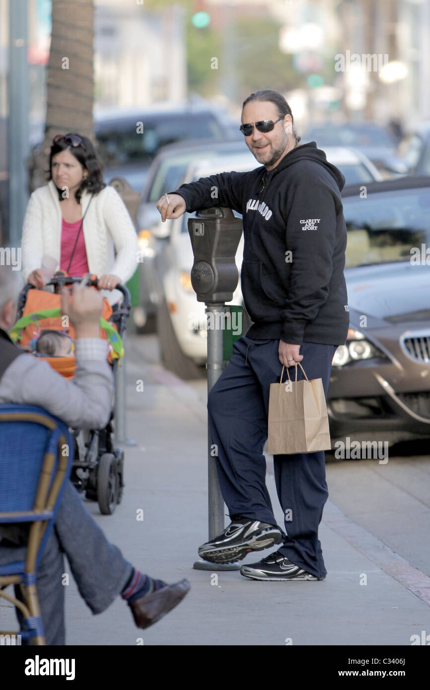 Russell Crowe smokes a cigarette out and about with his wife in Beverly ...