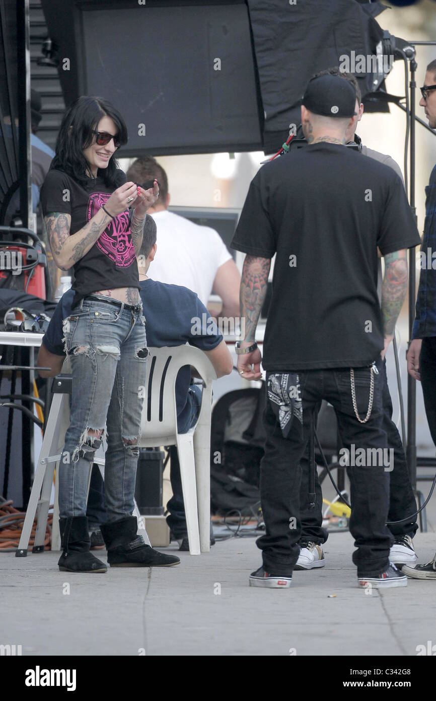 Tattooed mystery women and Benji Madden on the set of a photo shoot for ...