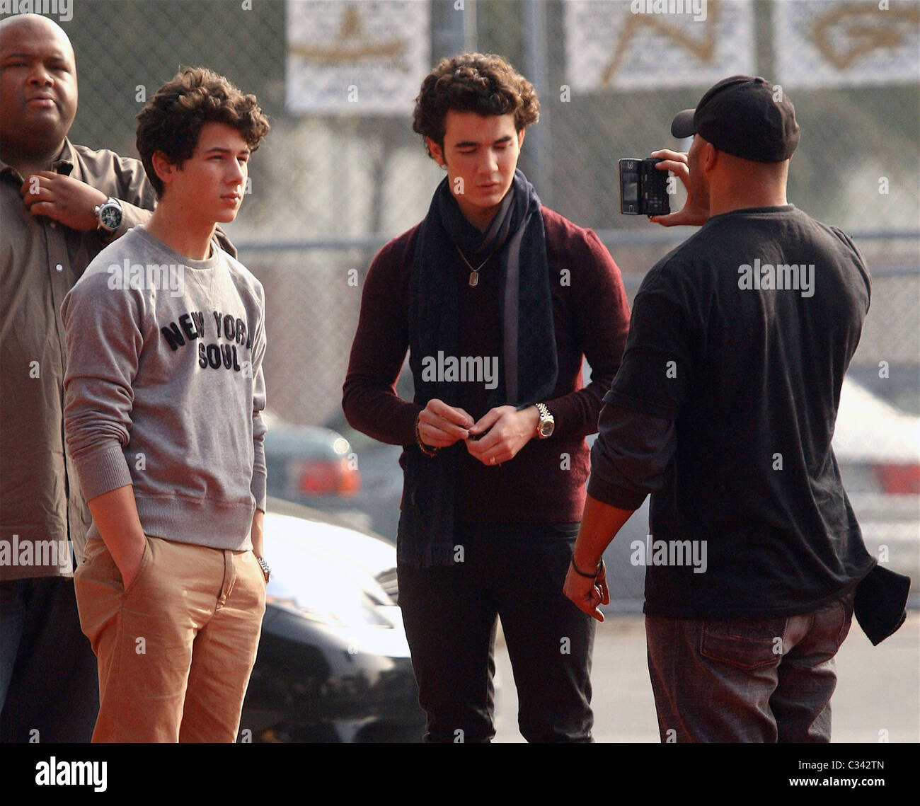 Nick Jonas and Kevin Jonas of the Jonas Bothers shopping at Christian ...