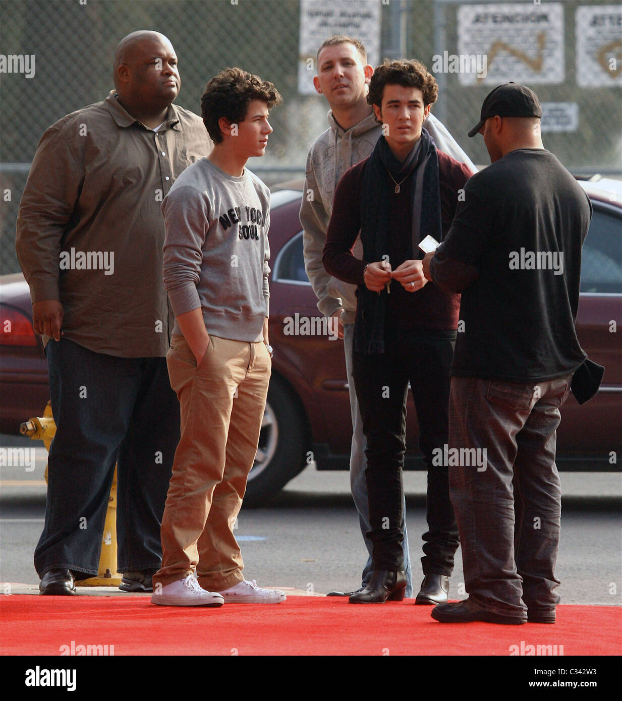 Nick Jonas and Kevin Jonas of the Jonas Bothers shopping at Christian ...