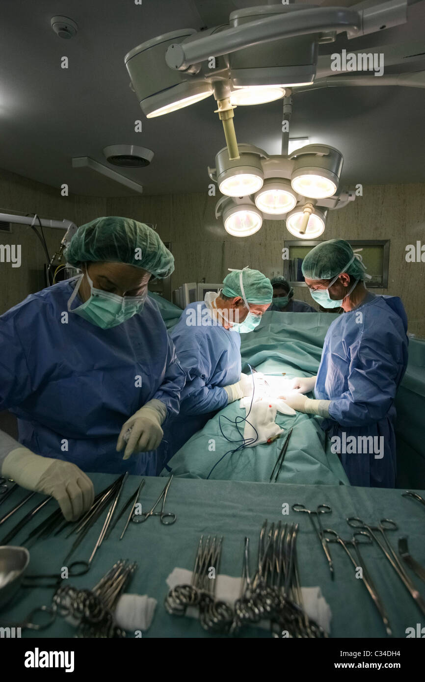 Doctors performing surgery in hospital operating room Stock Photo - Alamy