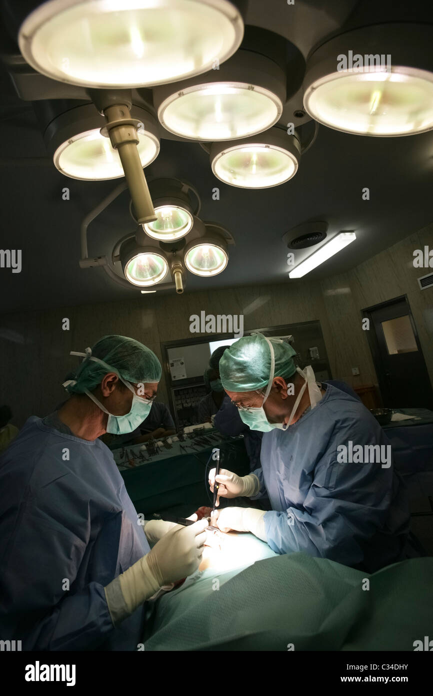 Doctors performing surgery in hospital operating room Stock Photo - Alamy