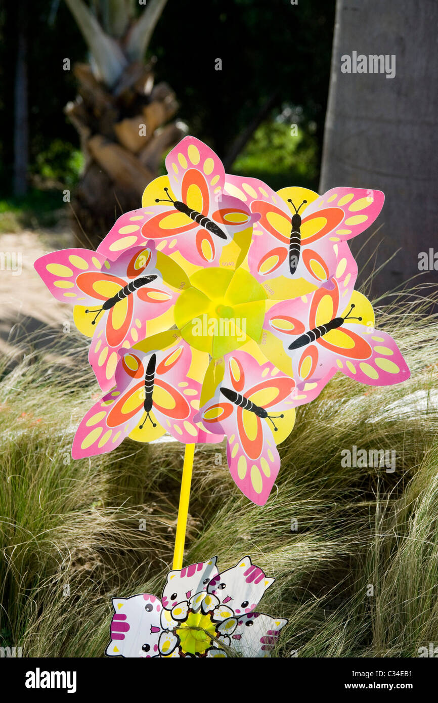 Colorful Toy Windmill in the meadow Stock Photo - Alamy