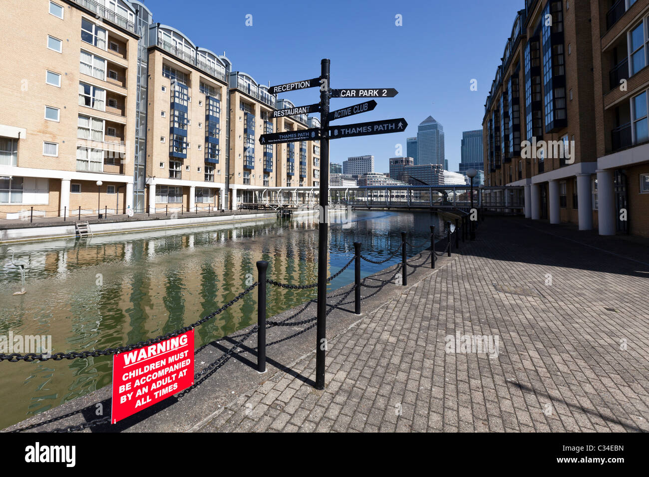 Signpost with Canary Wharf in the background, London, England, UK Stock ...