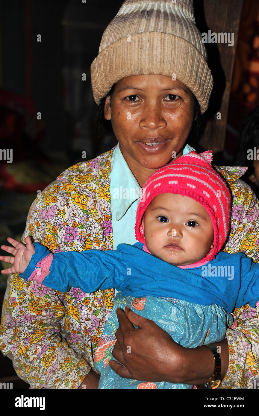 Happy dad carries serious podgy cute son Stock Photo - Alamy