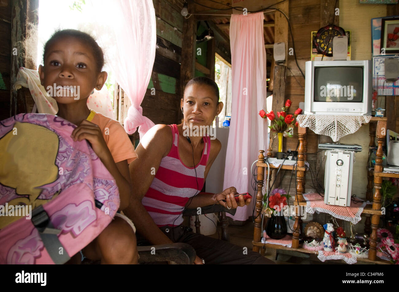 smiling happy mother child daughter inside interior clapboard poverty ...