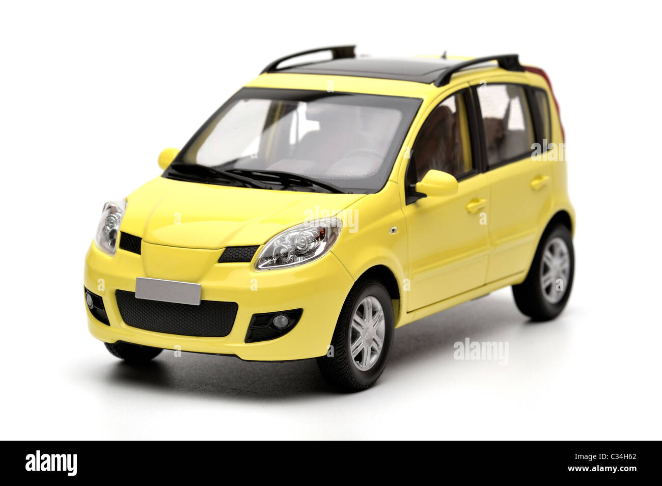 Generic modern yellow family car model on a white background, isolated ...