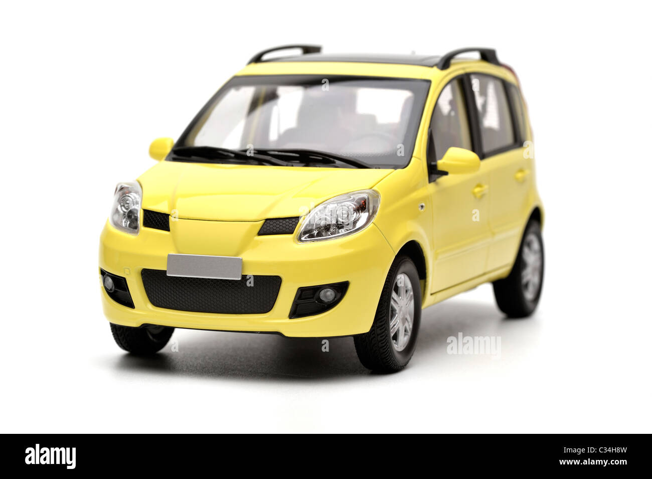 Generic modern yellow family car model on a white background, isolated ...