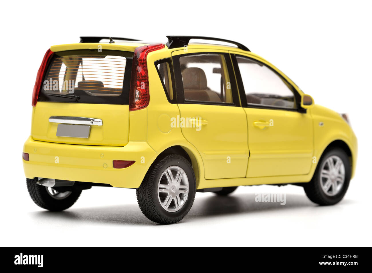 Generic modern yellow family car model on a white background, isolated ...