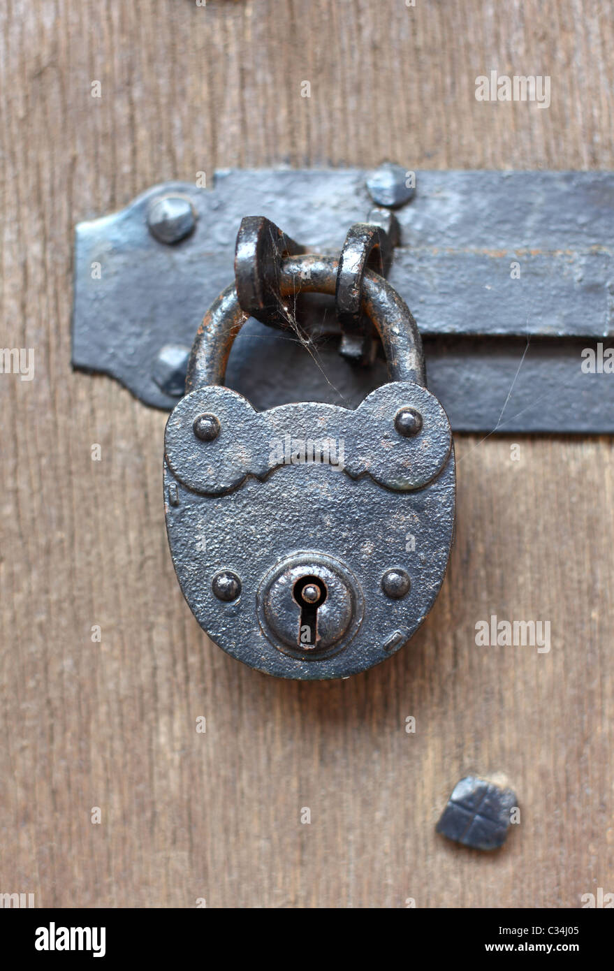 Ancient padlock at a wooden door Stock Photo - Alamy