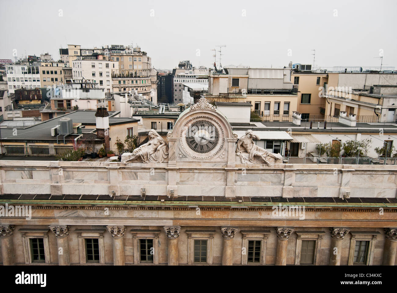 Clock on a building, Milan, Italy Stock Photo - Alamy