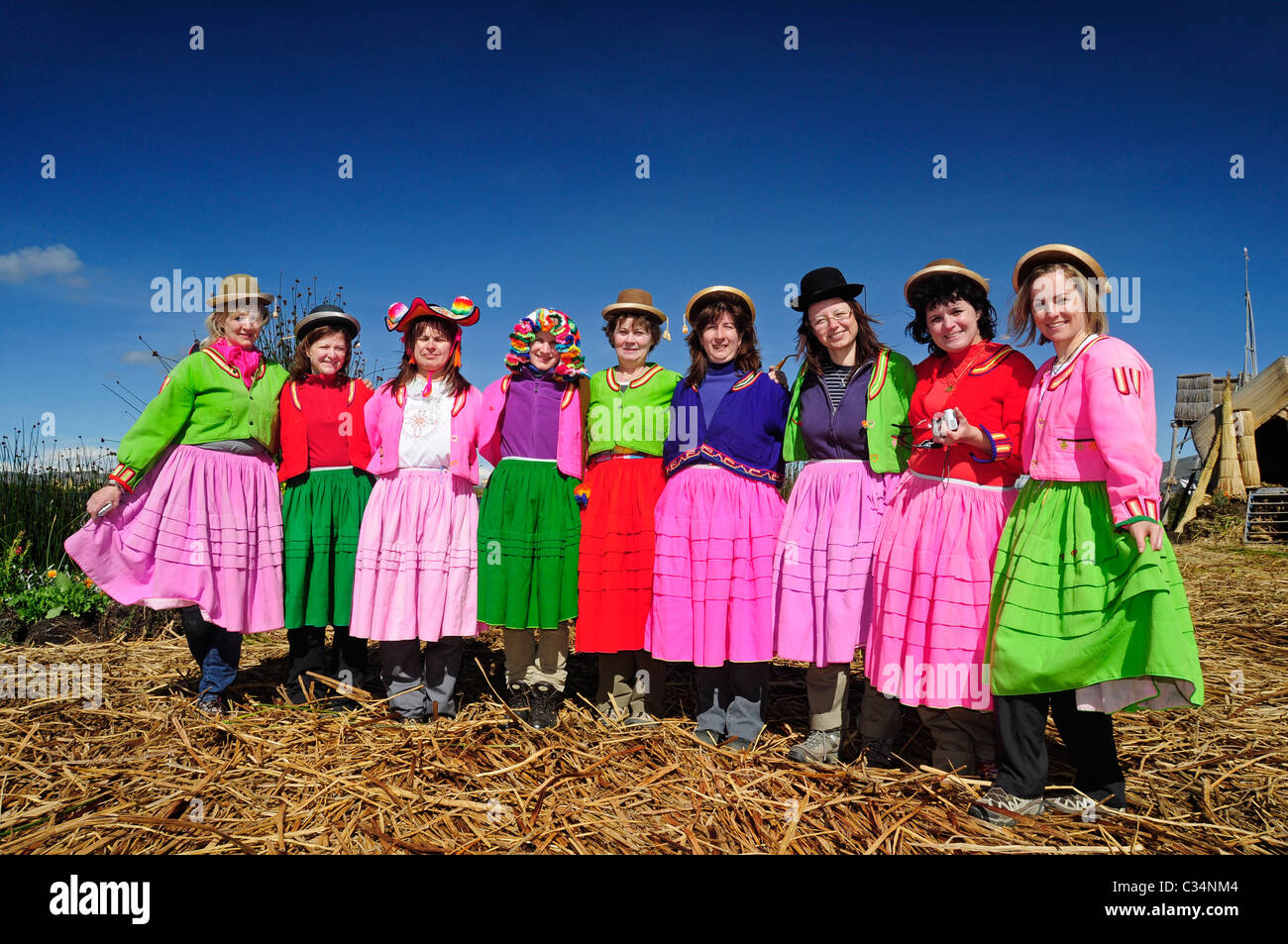 Group og tourist in tradtional peruvian clothes Stock Photo - Alamy