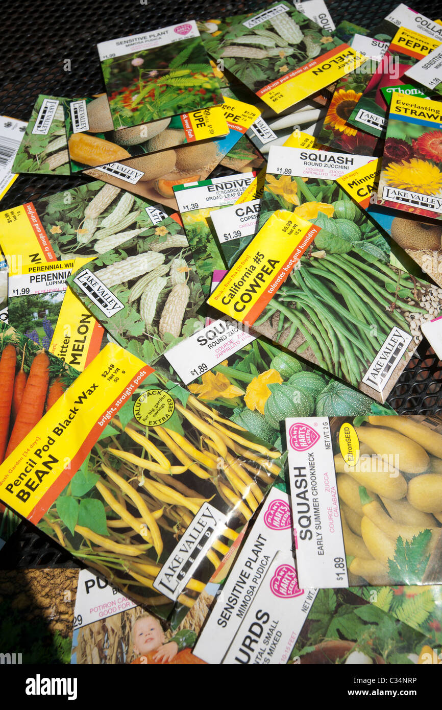 A collection of various seed packets is seen in a community garden in ...