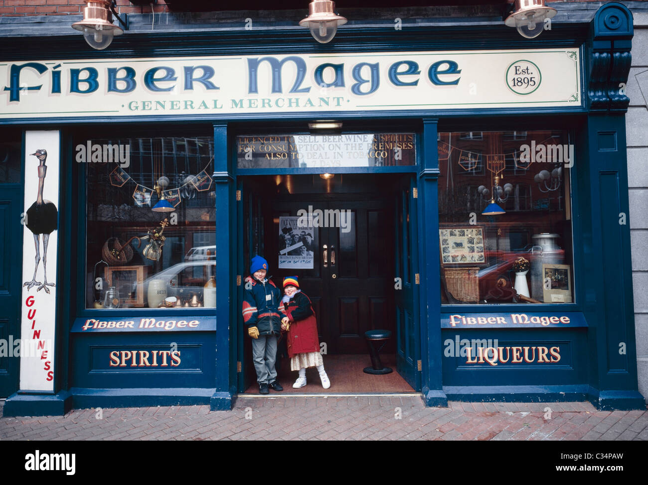 Belfast,Co Antrim,Northern Ireland;Shopfront With Children Standing In ...