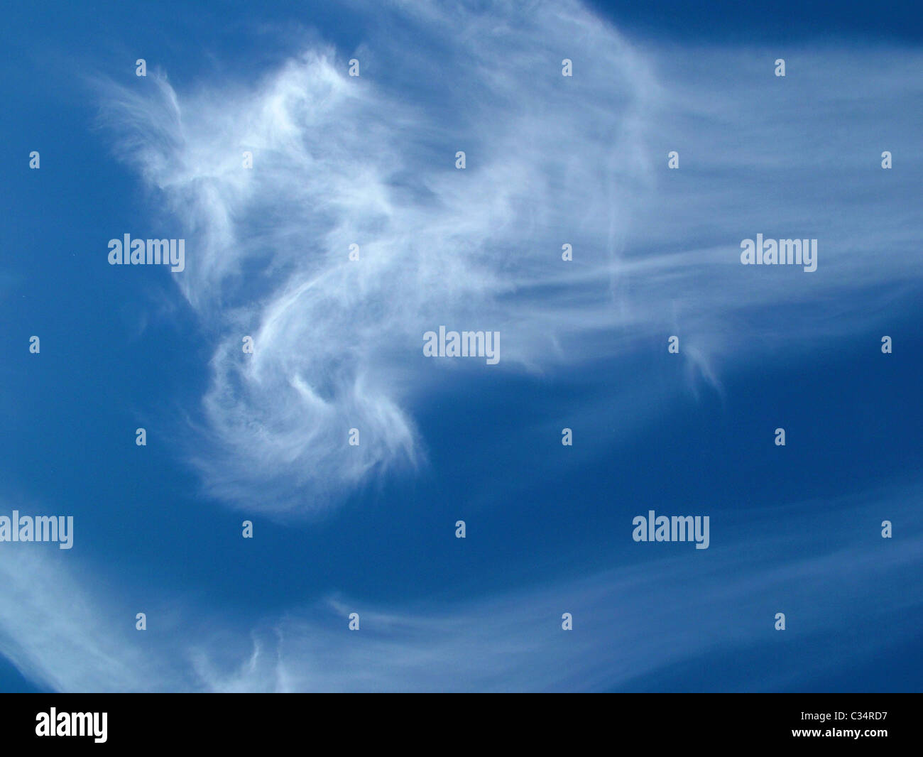 cirrus clouds in a blue sky - high level clouds signifying a possible ...