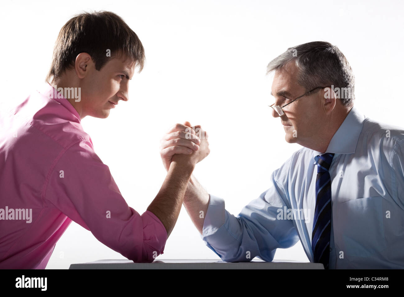 Portrait of two businessmen fighting over white background Stock Photo ...