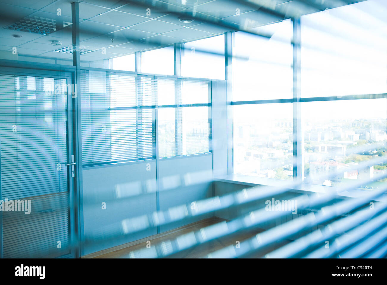 Image of corridor in office building with big windows passing daylight ...