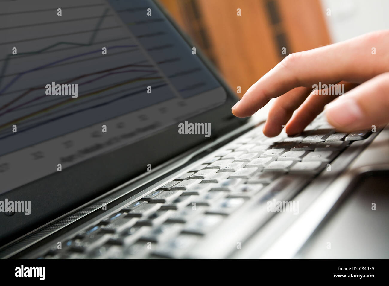 Close-up of male hand over keyboard of laptop during computer work ...