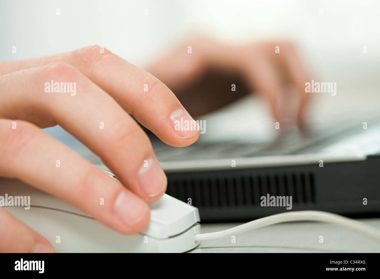 Close-up of human hand on white mouse during computer work Stock Photo ...