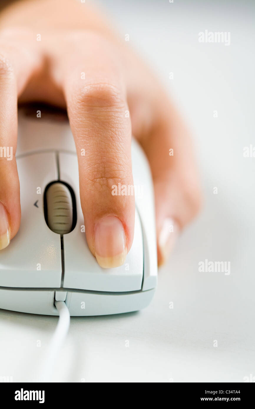 Close-up of female hand on white mouse during computer work Stock Photo ...