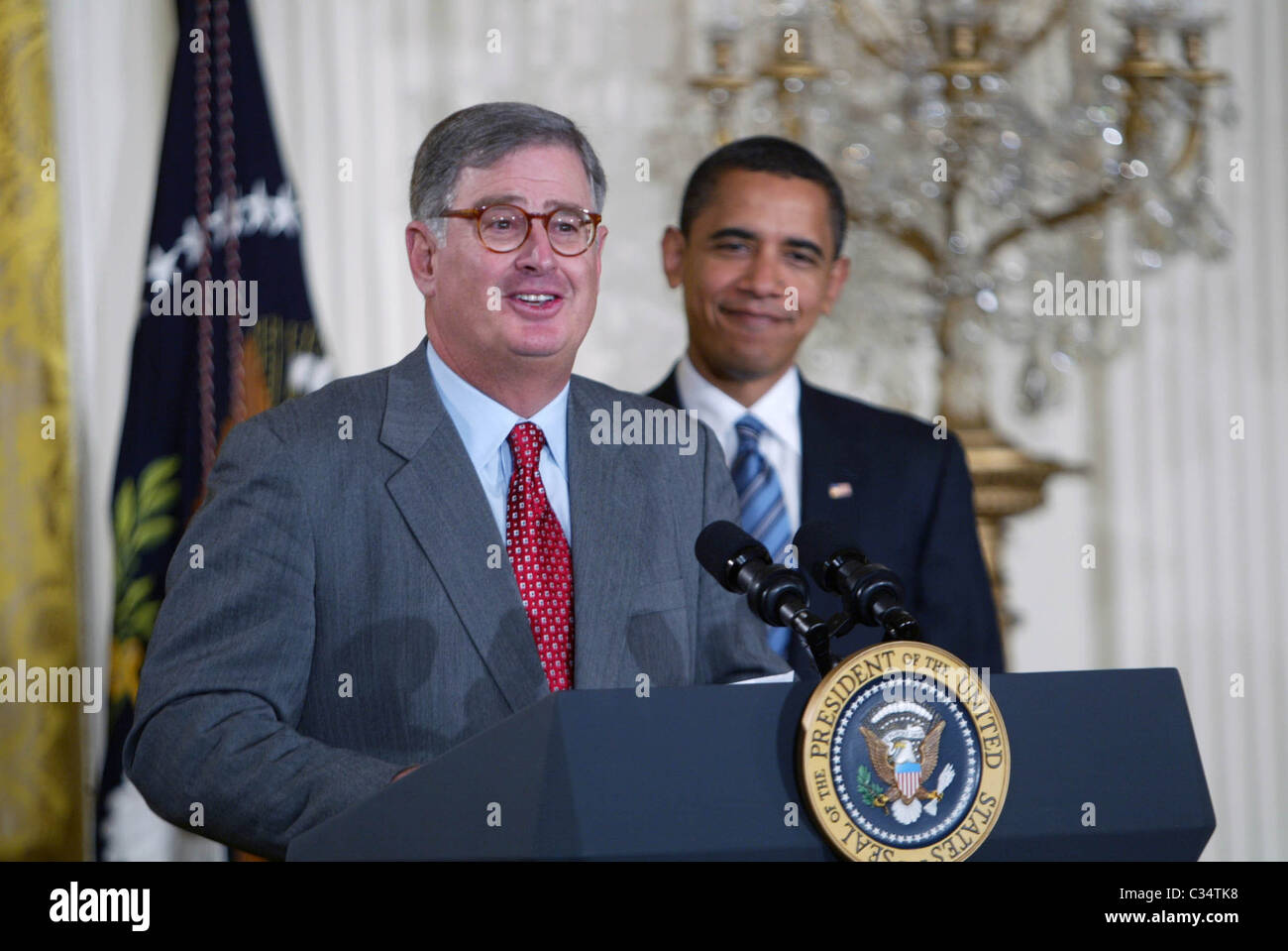 US President Barack Obama (r) listens as Sam Palmisano, Chairman, CEO ...