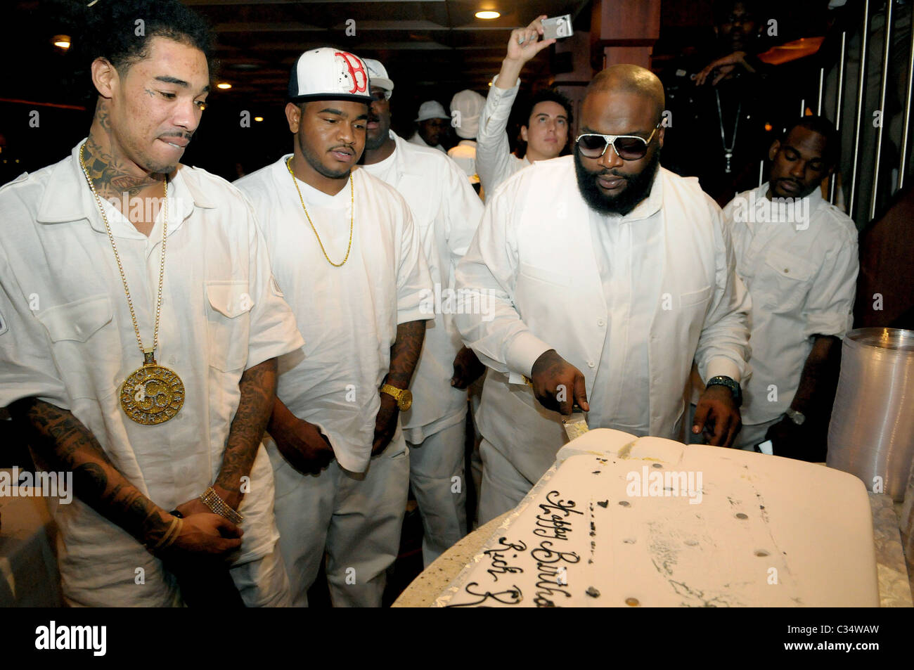 Rick Ross and Friends Rick Ross cuts his birthday cake during his 'Big ...