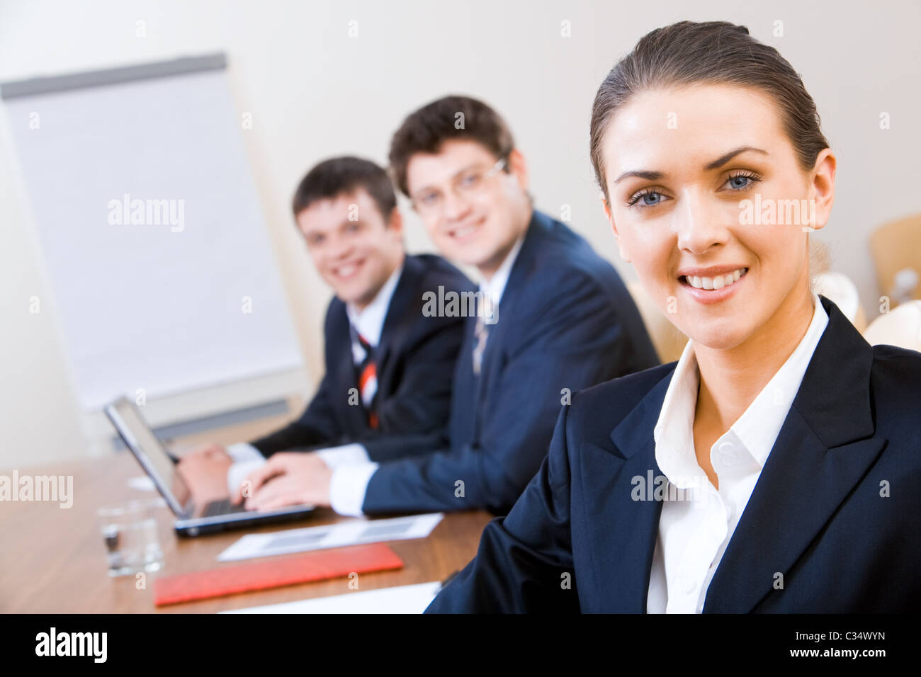 Image of attractive secretary with two men on background Stock Photo ...