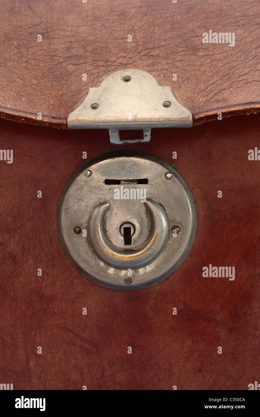 An open lock on an old leather case Stock Photo - Alamy